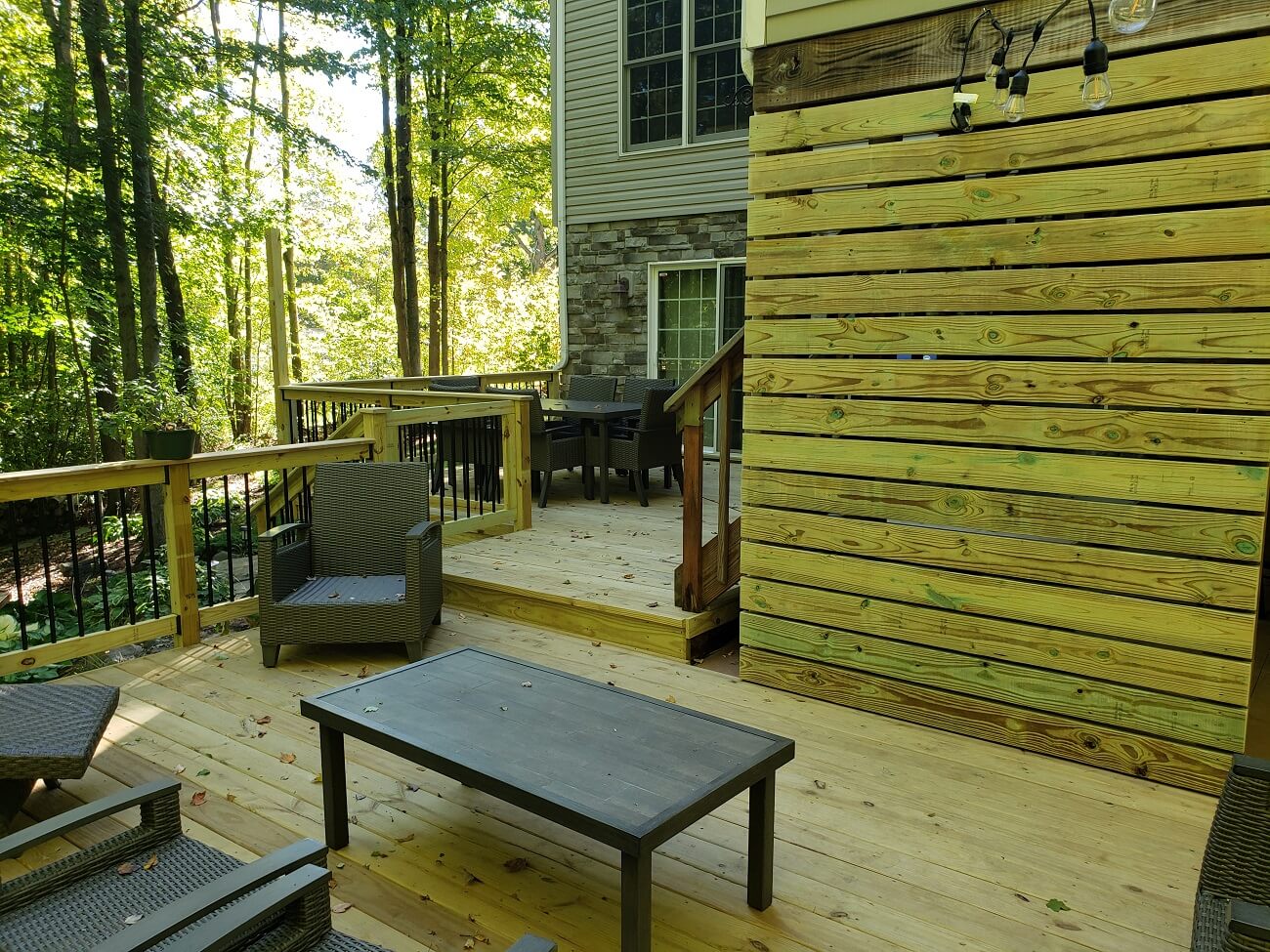 How to design and build a wooden deck and stamped concrete patio.