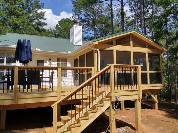 A new deck adjacent to a new screened porch spells outdoor living bliss.